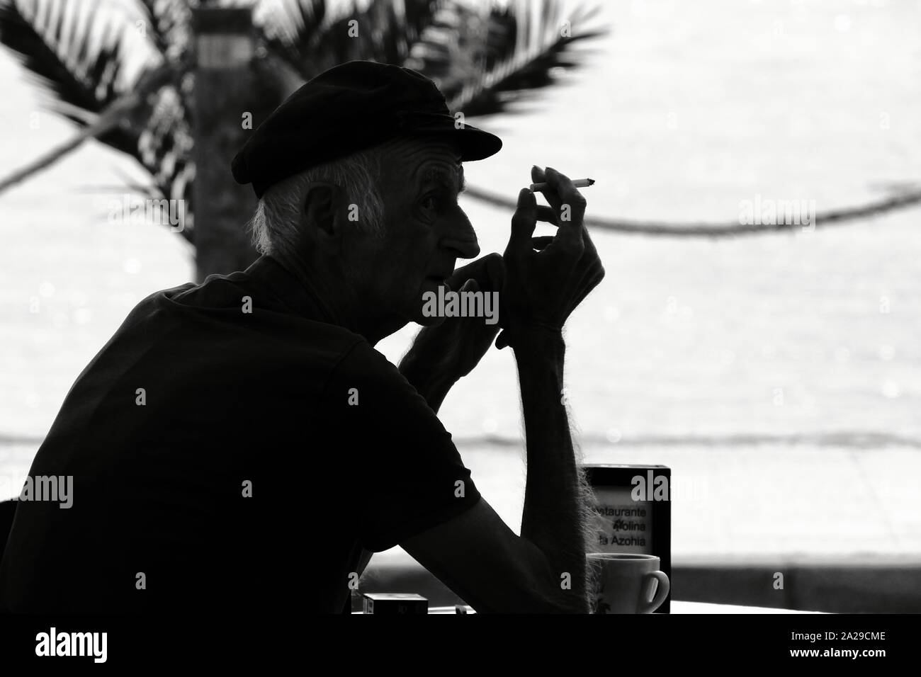 Alicante, Spain- October 1, 2019: Old sailor smoking alone on the ...
