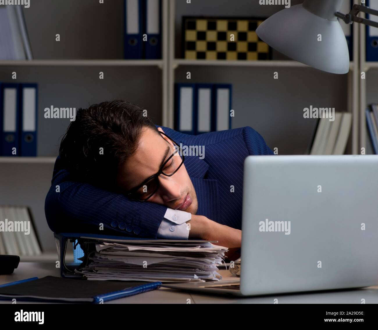Businessman tired and sleeping in the office after overtime hours Stock ...