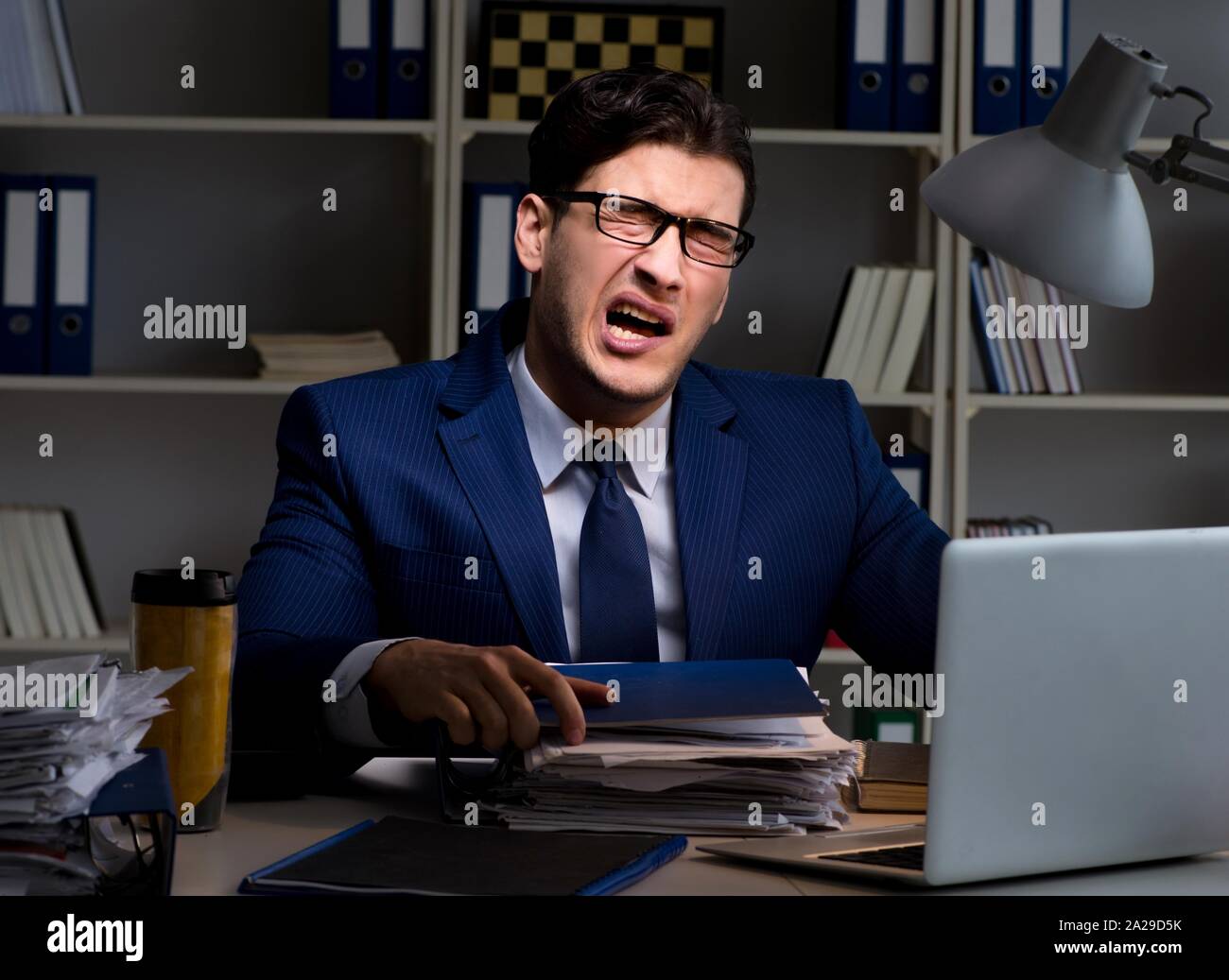 The employee working late to finish important deliverable task Stock ...