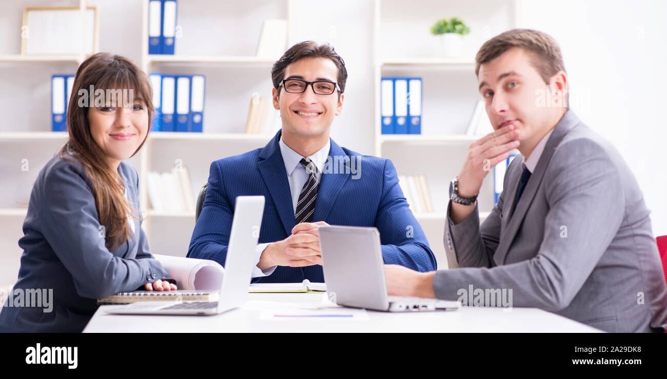 Joyful office employees sitting table hi-res stock photography and ...