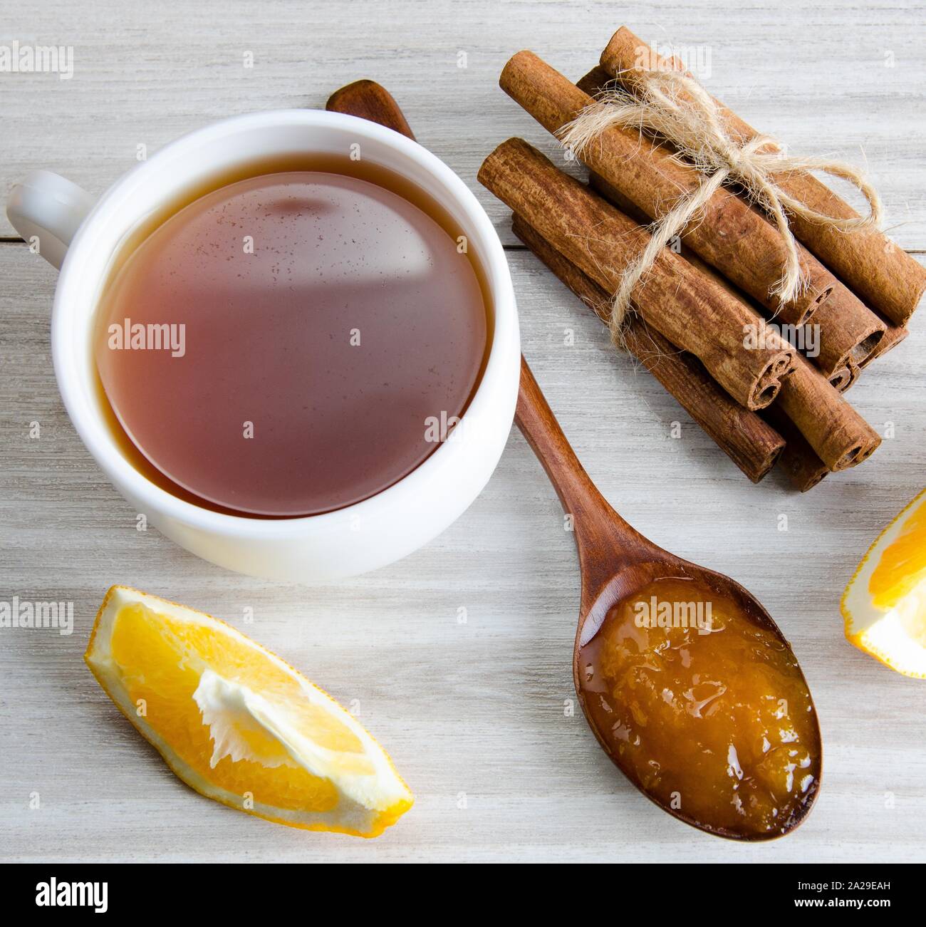 The cup of tea served with orange jam Stock Photo - Alamy