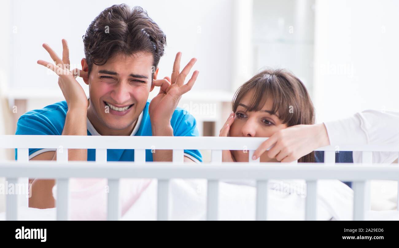 Crying baby stressed parents hi-res stock photography and images - Alamy