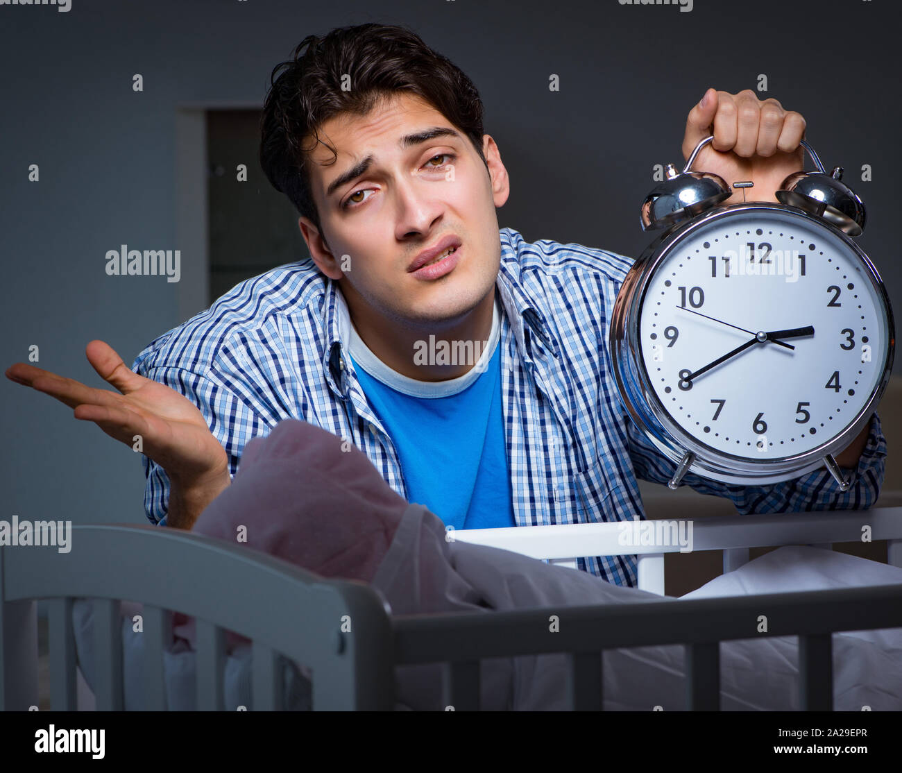 Young father dad sleeping while looking after newborn baby Stock Photo ...
