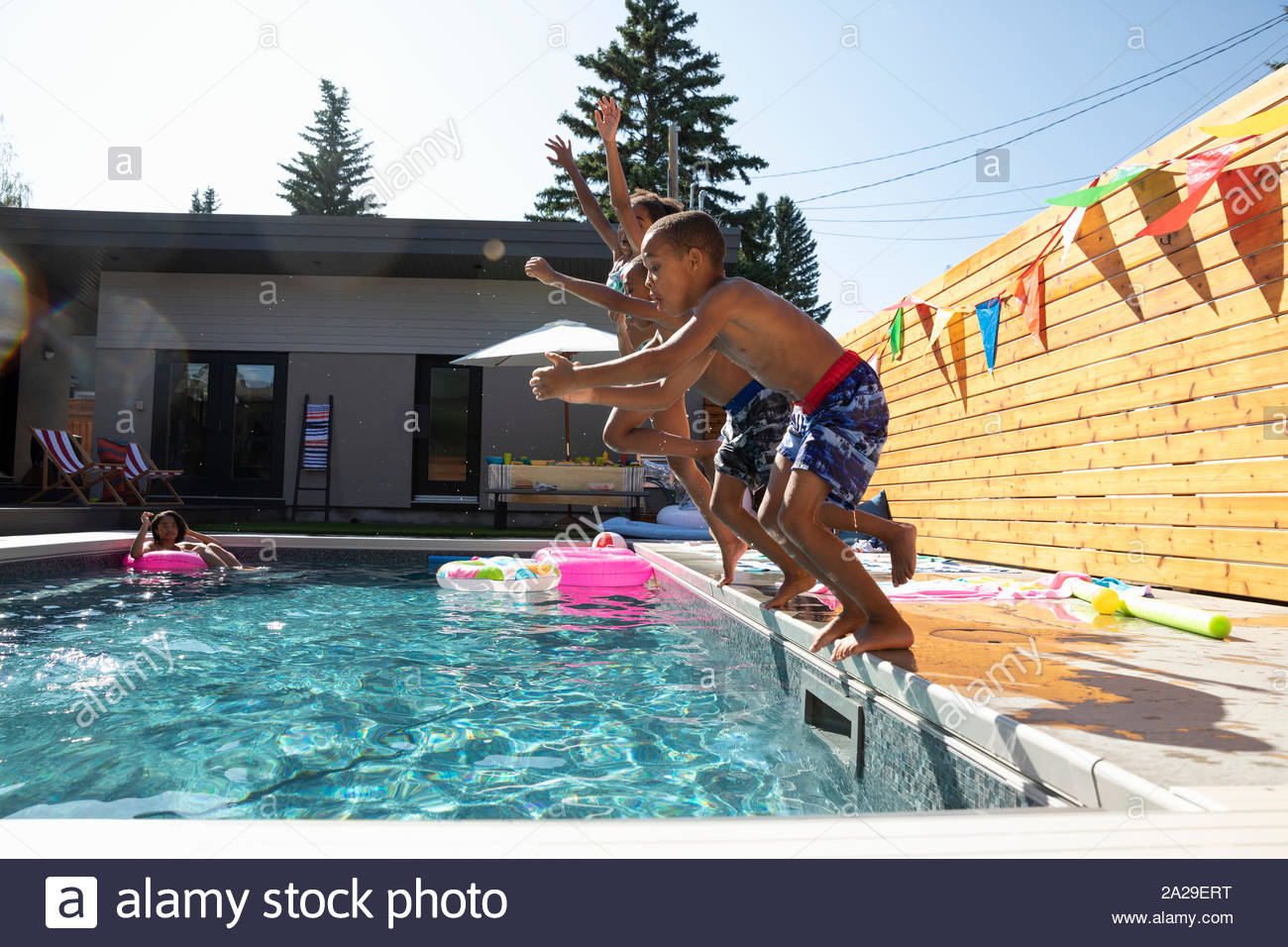 Family of four swimming pool hi-res stock photography and images - Alamy