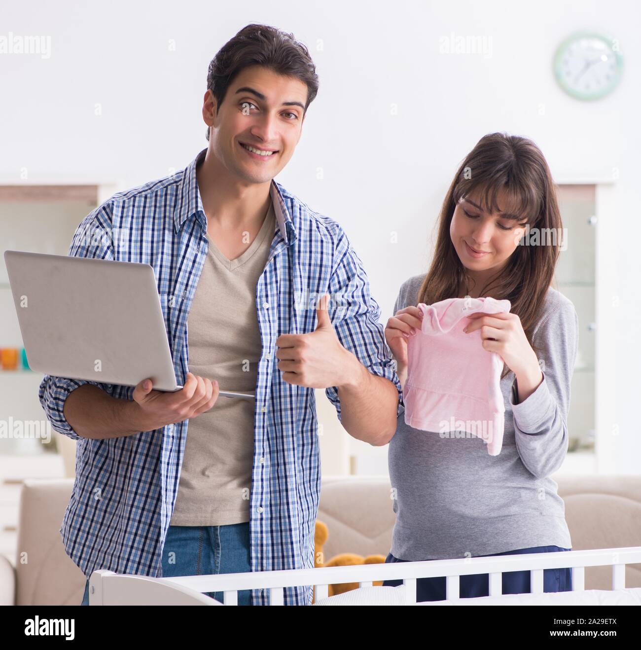 Young parents expecting their first baby Stock Photo - Alamy