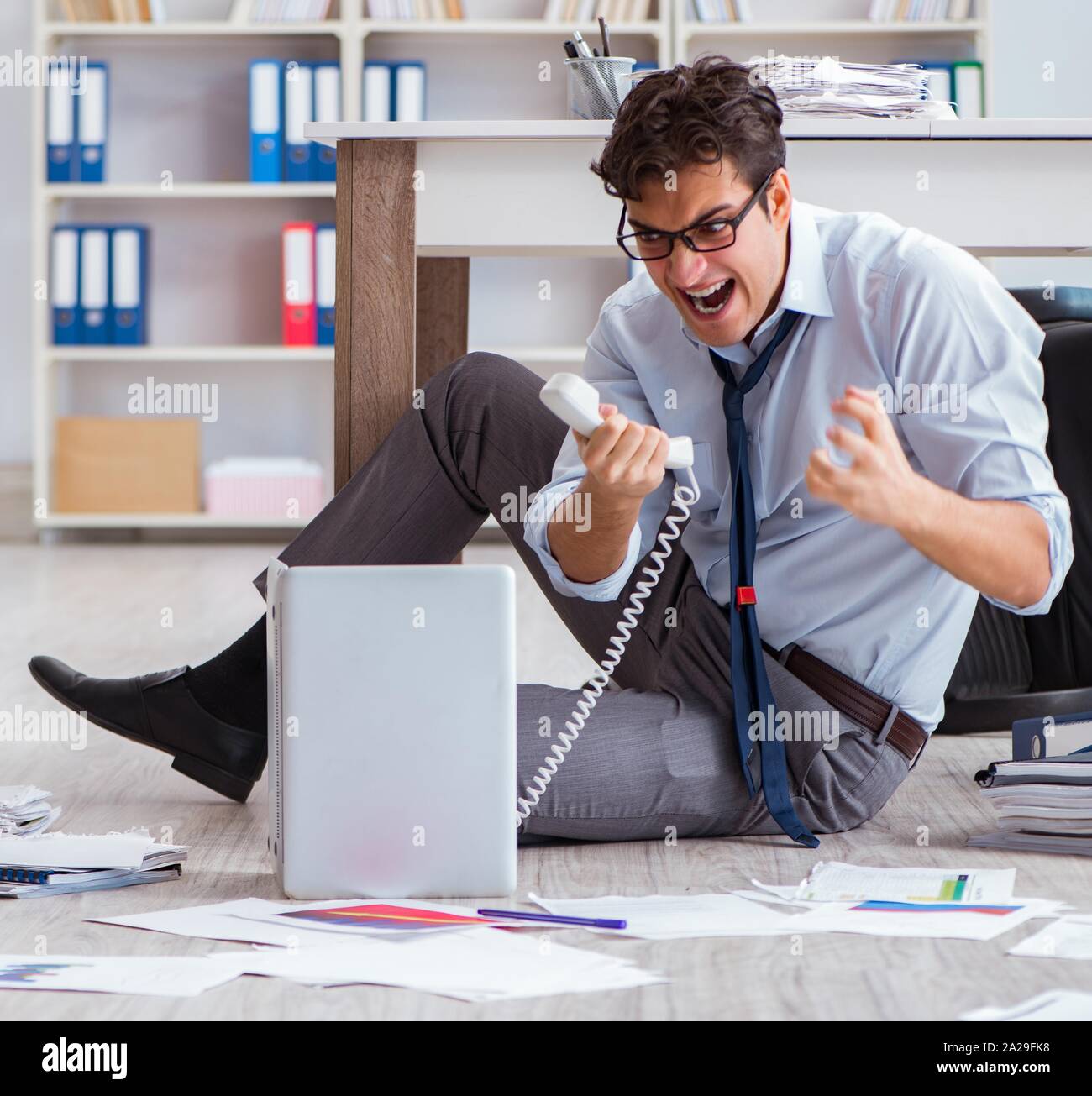 The bankrupt businessman angry in the office floor Stock Photo - Alamy