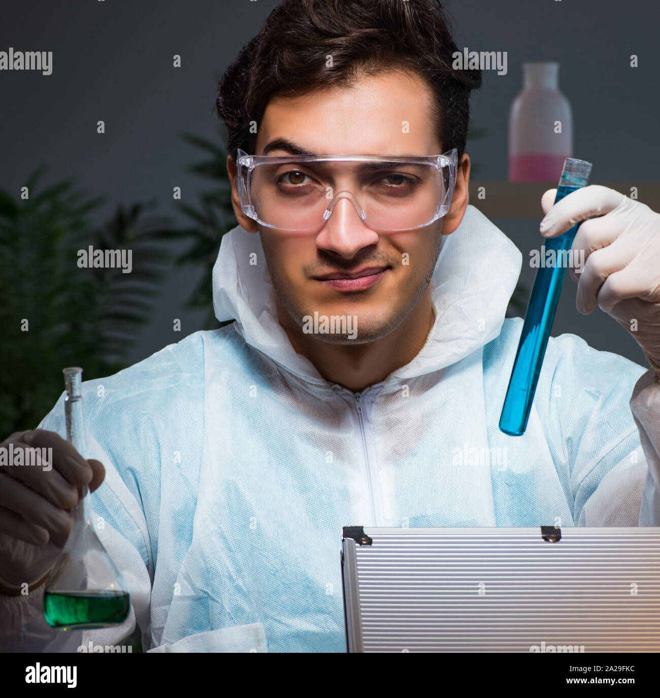 Forensic investigator collecting blood hi-res stock photography and ...
