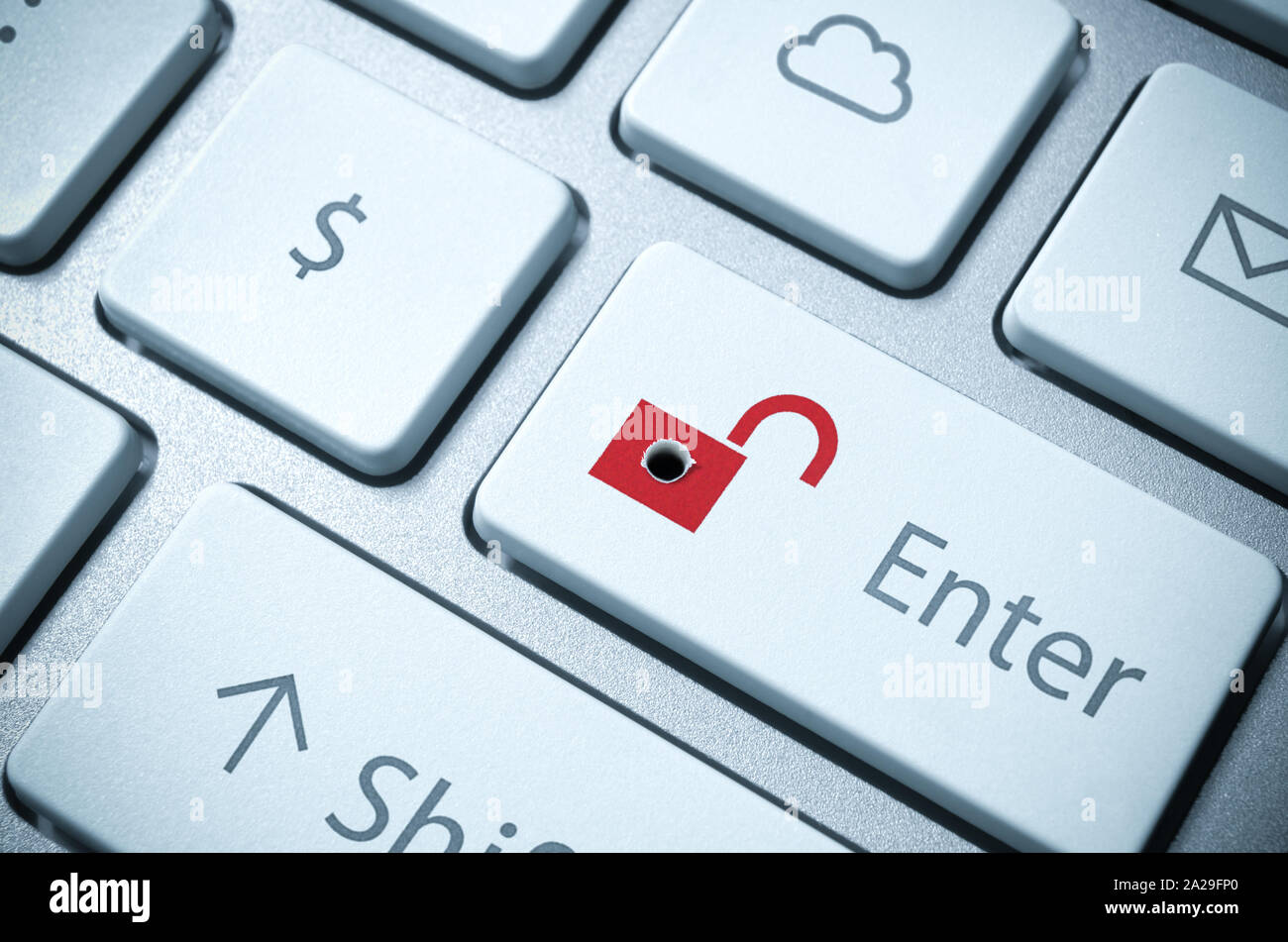 Security breach represented by hole on keyboard Stock Photo - Alamy