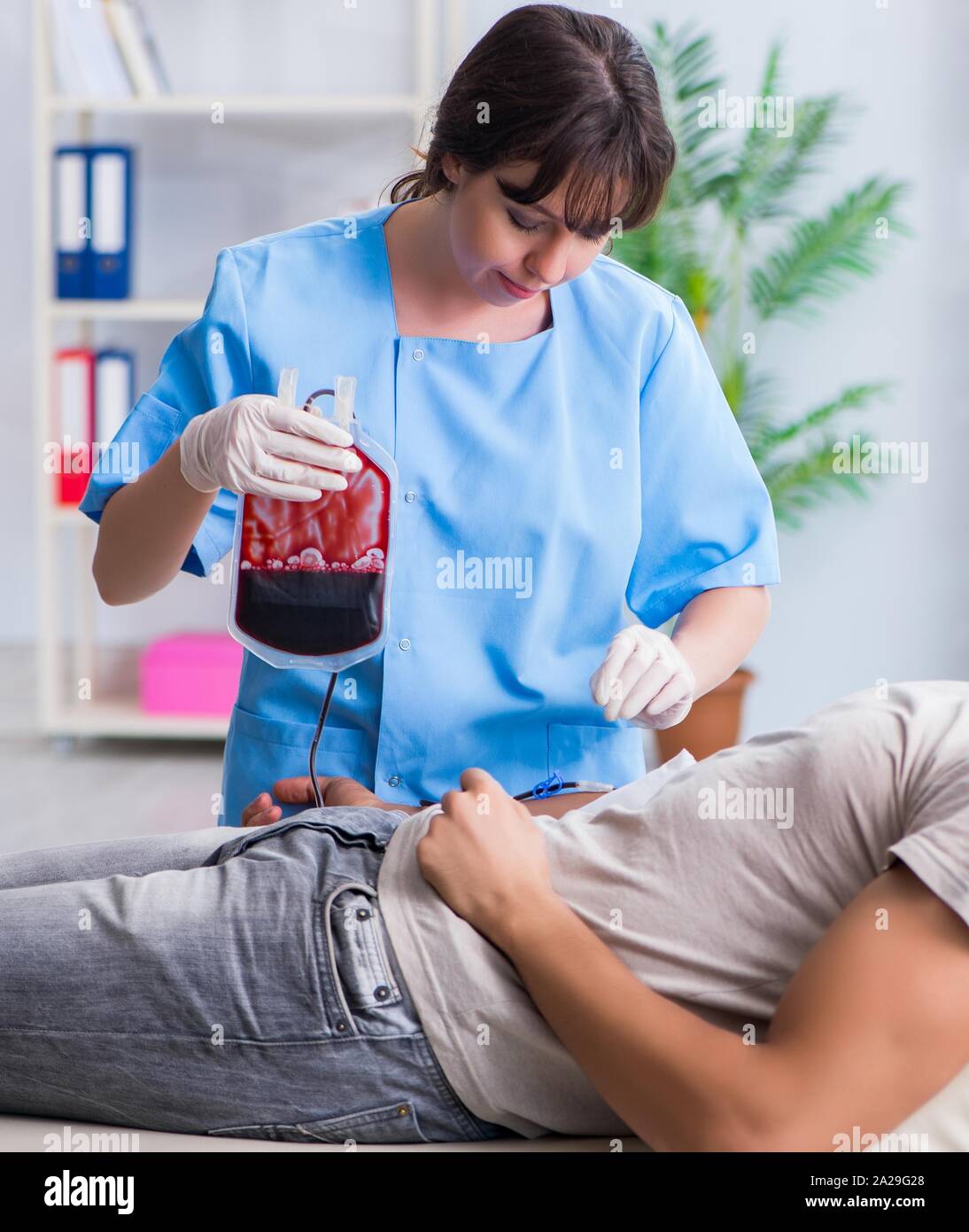 The patient getting blood transfusion in hospital clinic Stock Photo ...