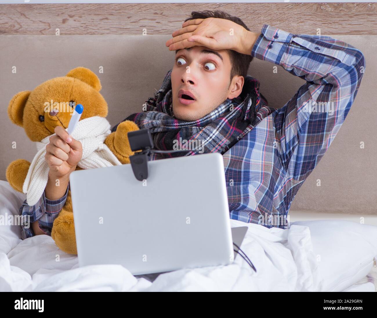 Sick man suffering from flu in the bed Stock Photo - Alamy