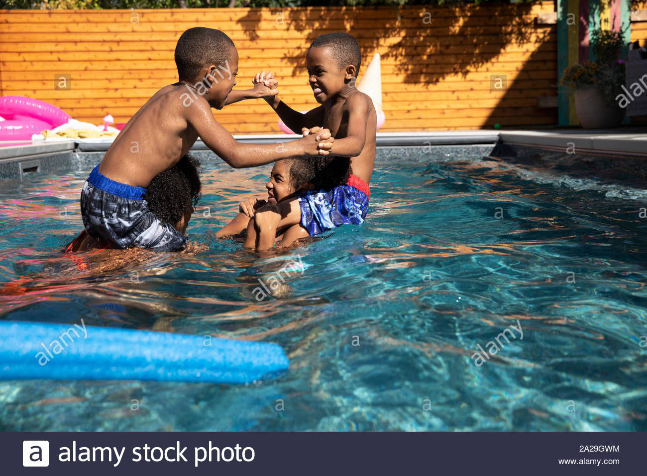 African brothers sisters playing hi-res stock photography and images ...