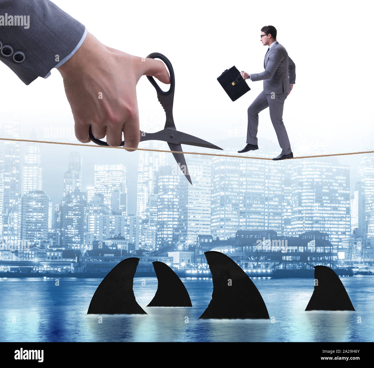 The hand cutting rope in business risk concept Stock Photo - Alamy