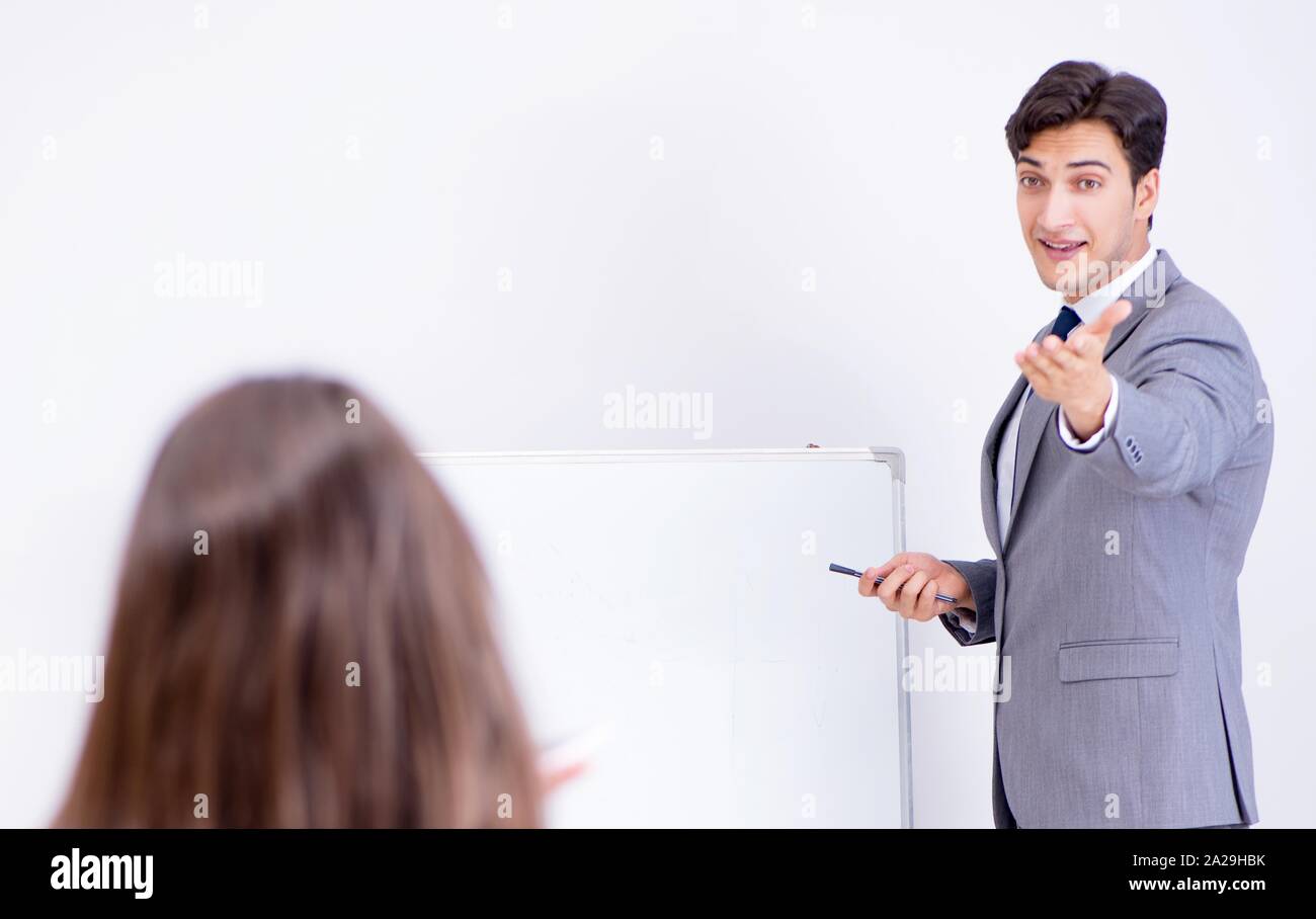 Business presentation in the office with man and woman Stock Photo - Alamy
