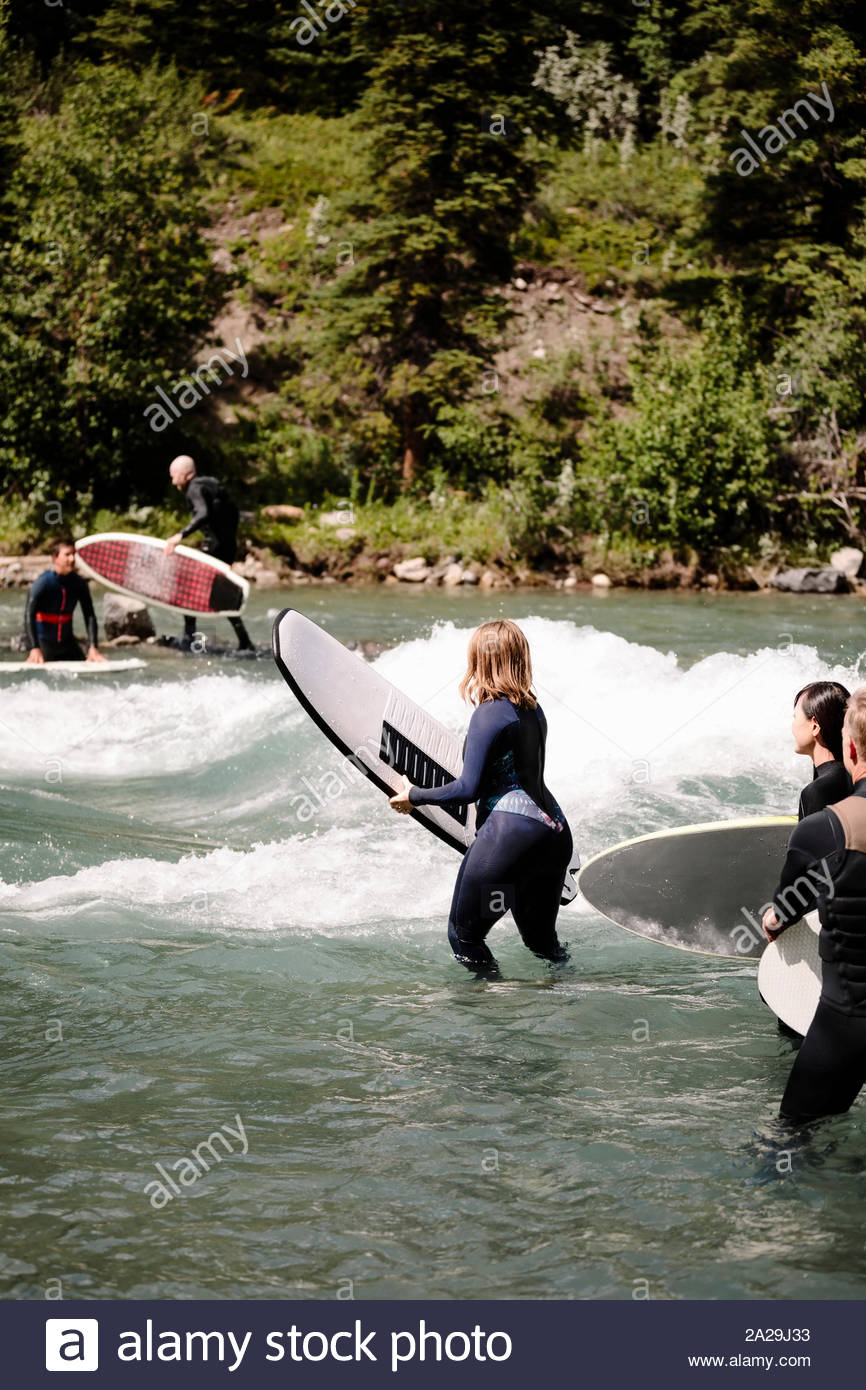 Surfing wading hi-res stock photography and images - Alamy