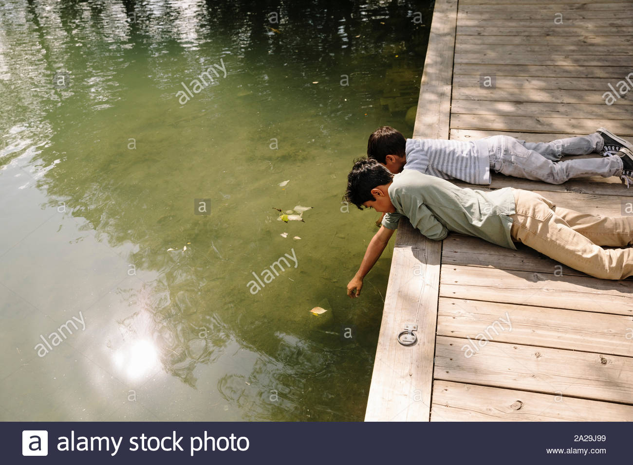 Child touching water hi-res stock photography and images - Alamy