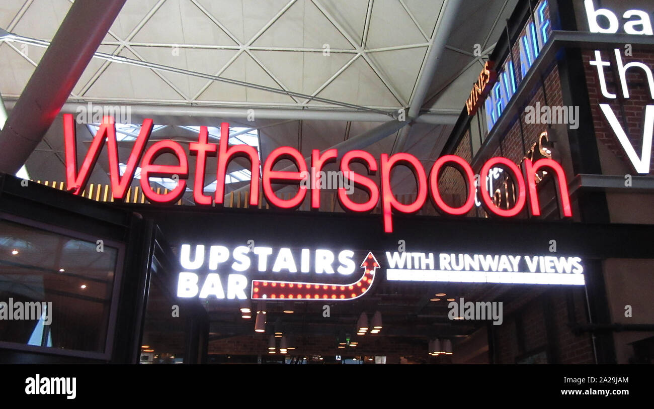 Wetherspoon signage and logo seen at their pub and restaurant in London ...
