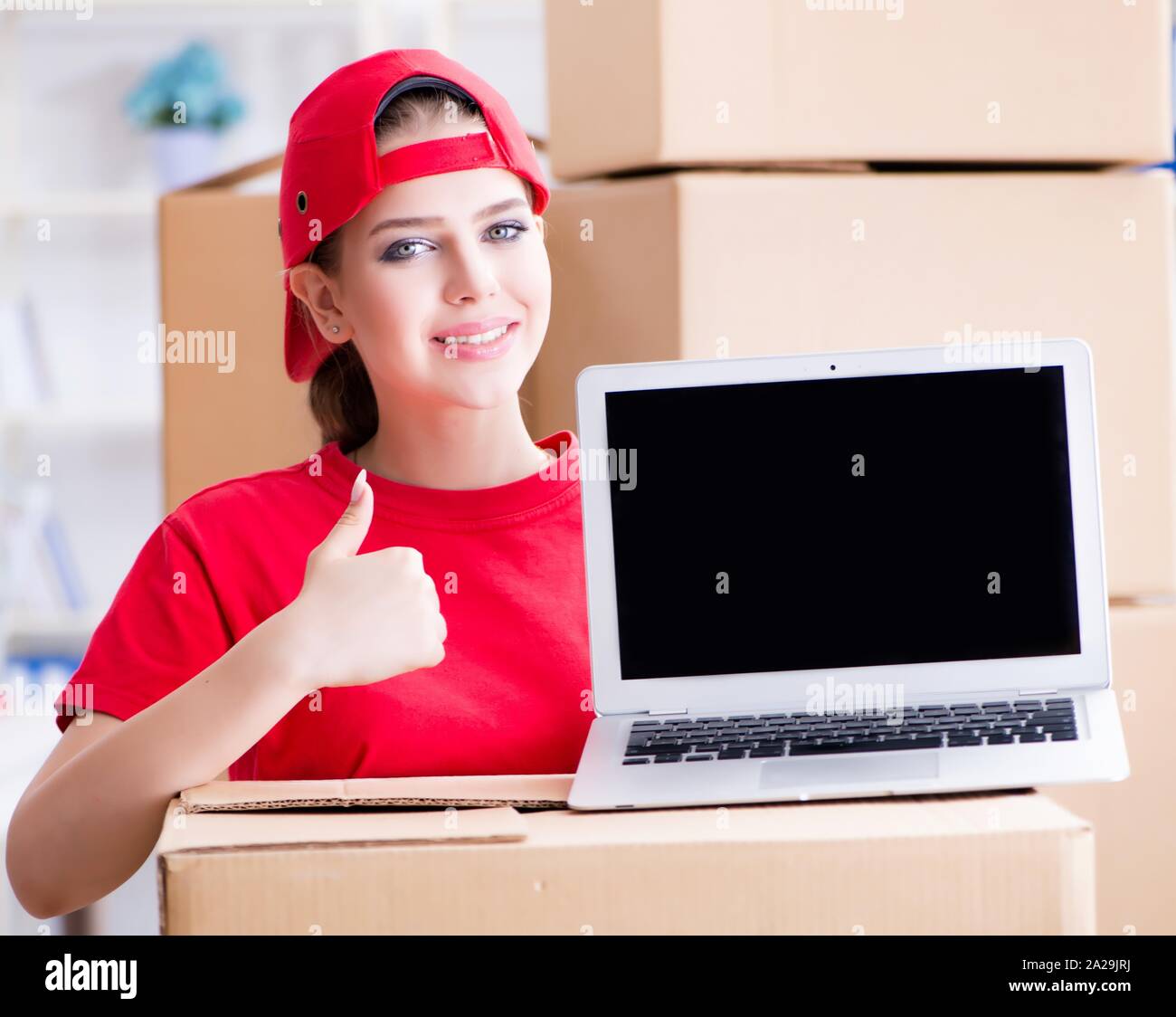 Young woman delivering boxes of personal effects Stock Photo - Alamy