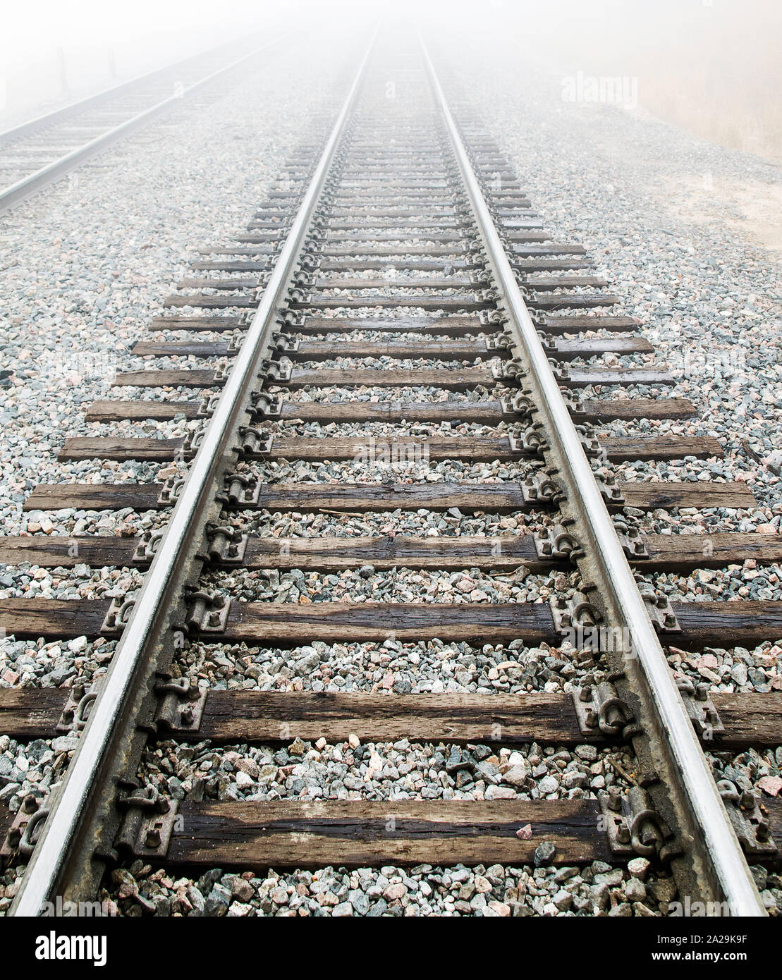 Train Tracks in the Fog - Colorado Stock Photo - Alamy