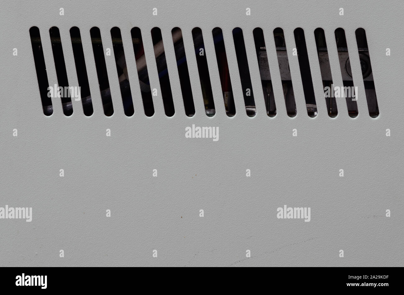 Power supply vent strips on beige powder coated surface Stock Photo - Alamy