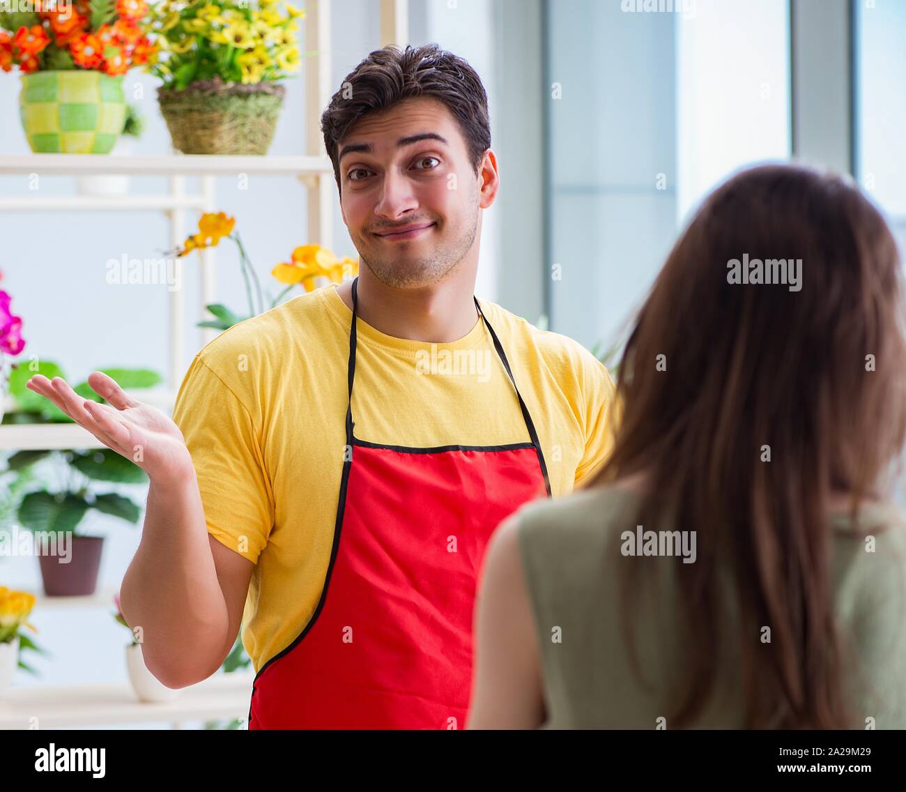 The florist selling flowers in a flower shop Stock Photo - Alamy