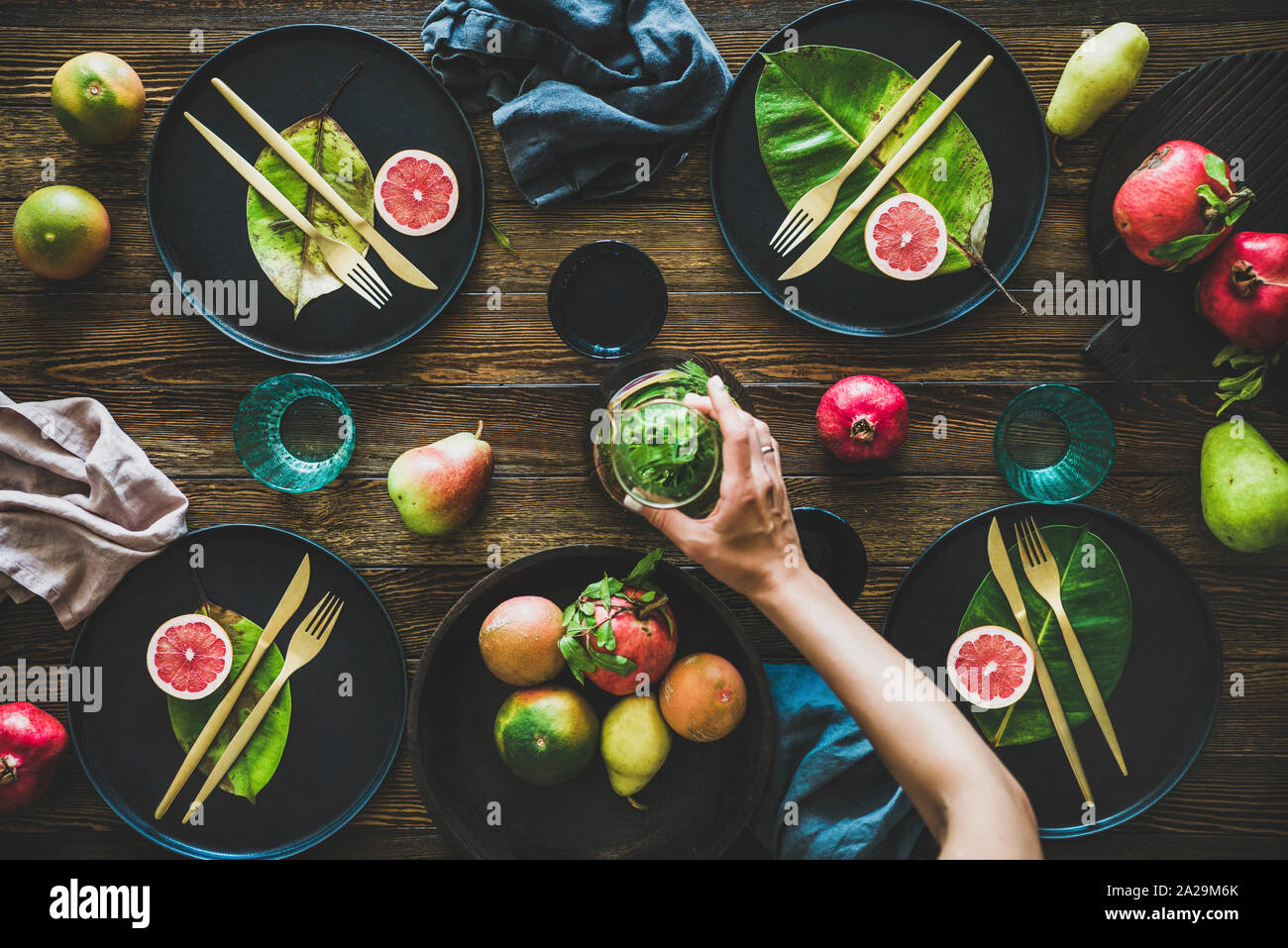 Autumn table styling for holiday dinner. Flat-lay of black dinnerware ...