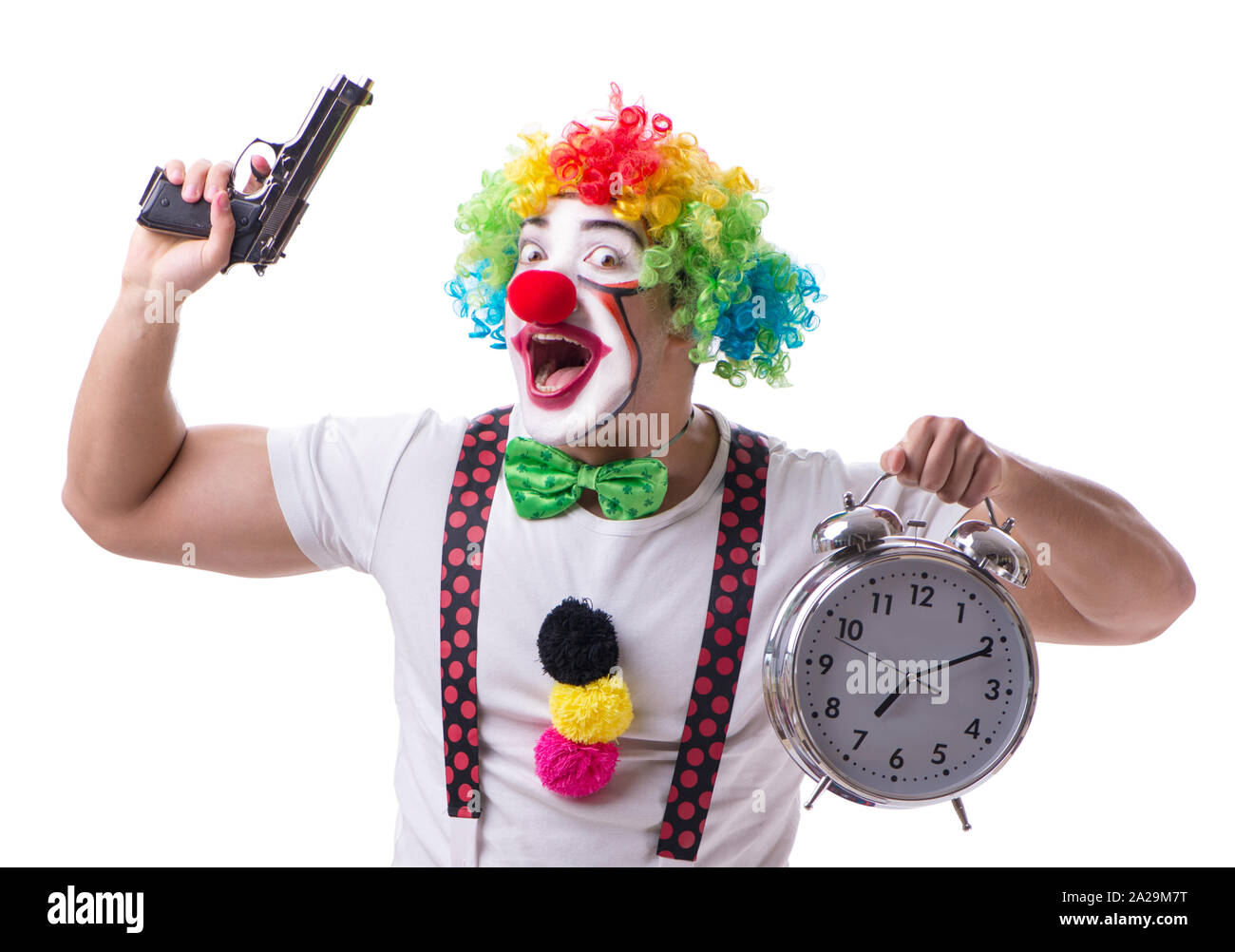 The funny clown with an alarm clock isolated on white background Stock ...