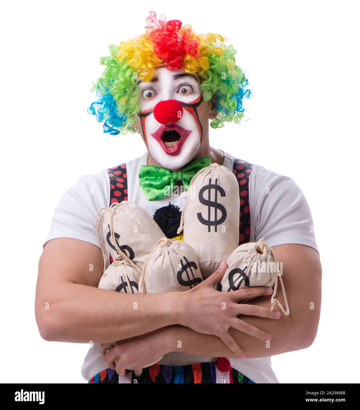 The funny clown with money sacks bags isolated on white background ...
