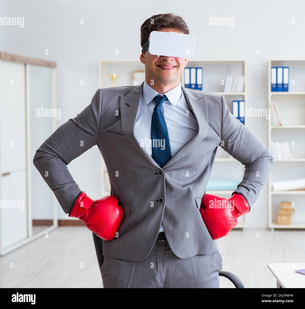 The man boxing in the office with virtual reality goggles Stock Photo ...