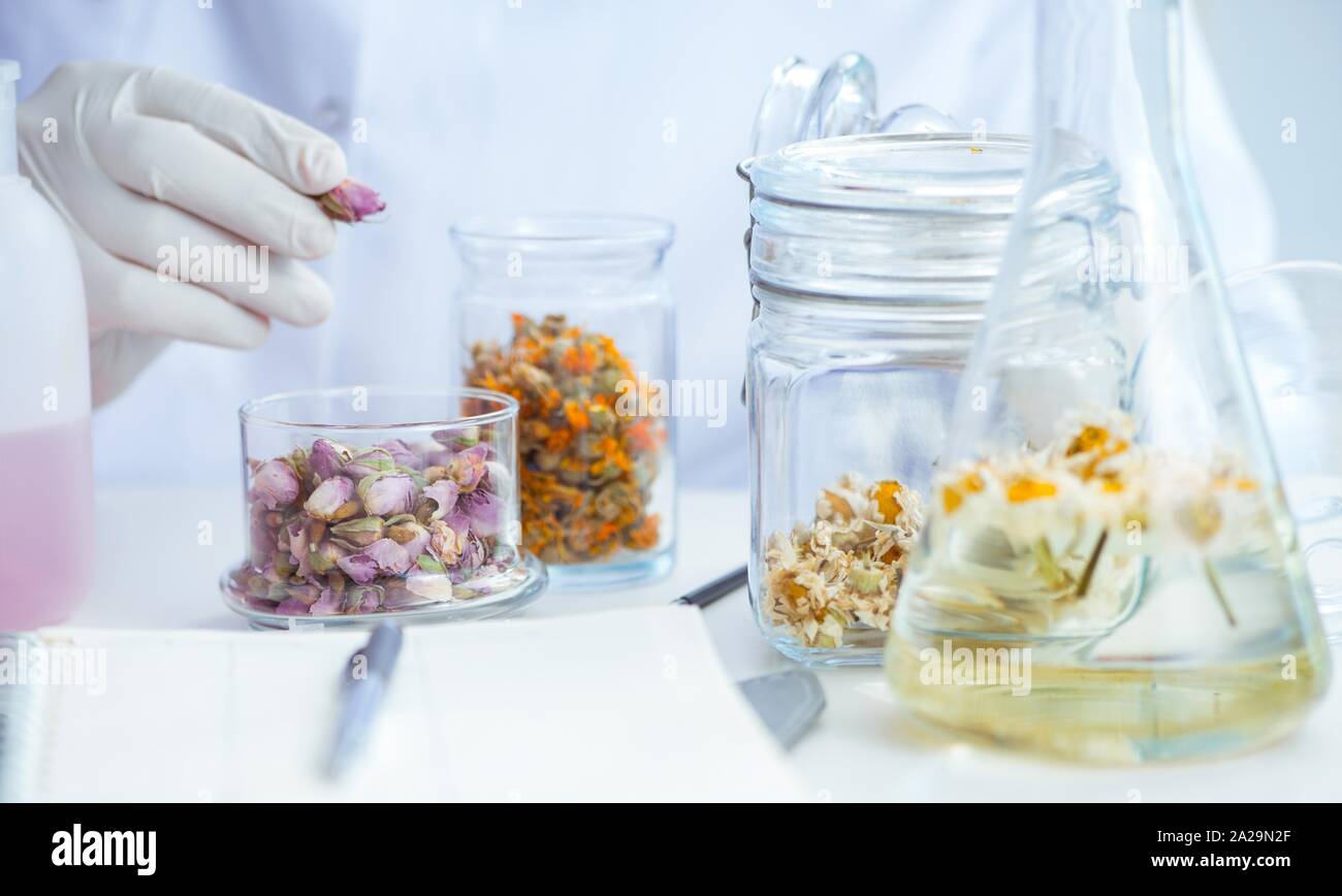 The chemist mixing perfumes in the lab Stock Photo - Alamy