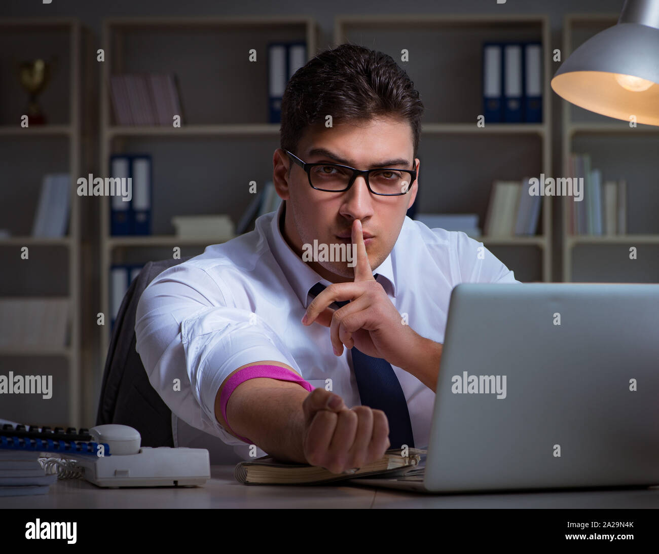 The businessman staying late in office for drugs Stock Photo - Alamy