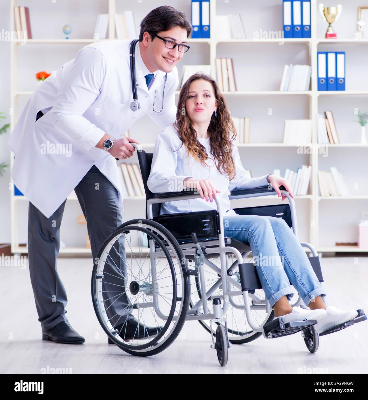 Disabled patient on wheelchair visiting doctor for regular check up ...