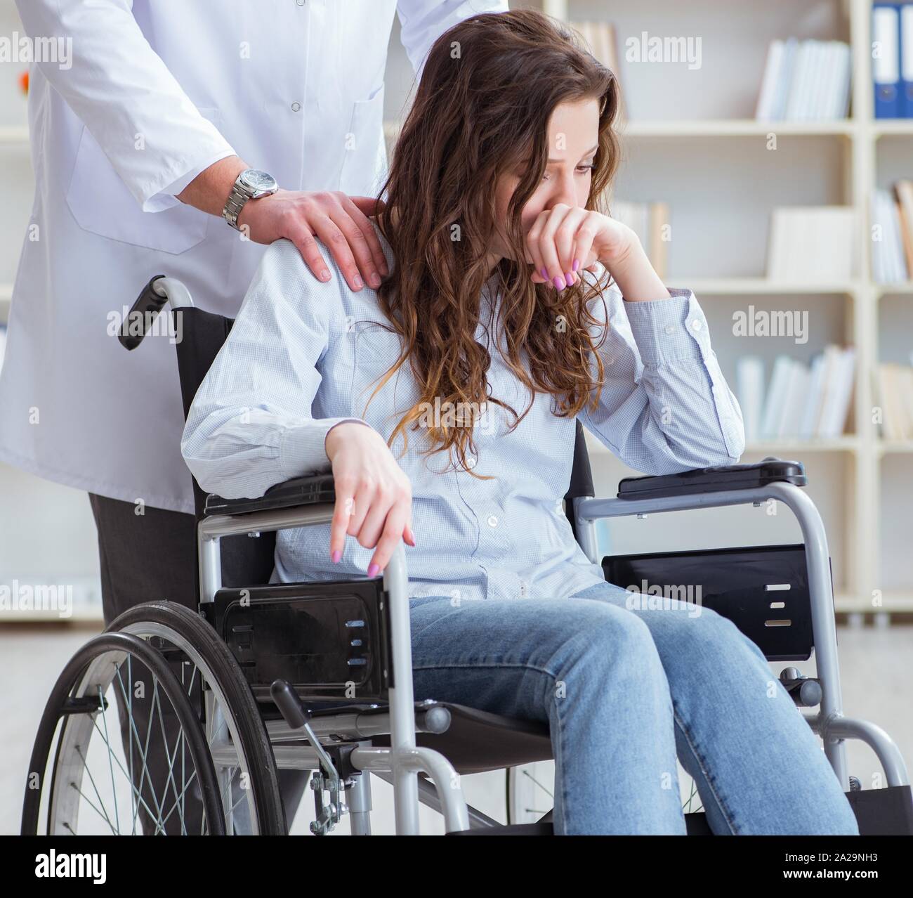 Disabled patient on wheelchair visiting doctor for regular check up ...