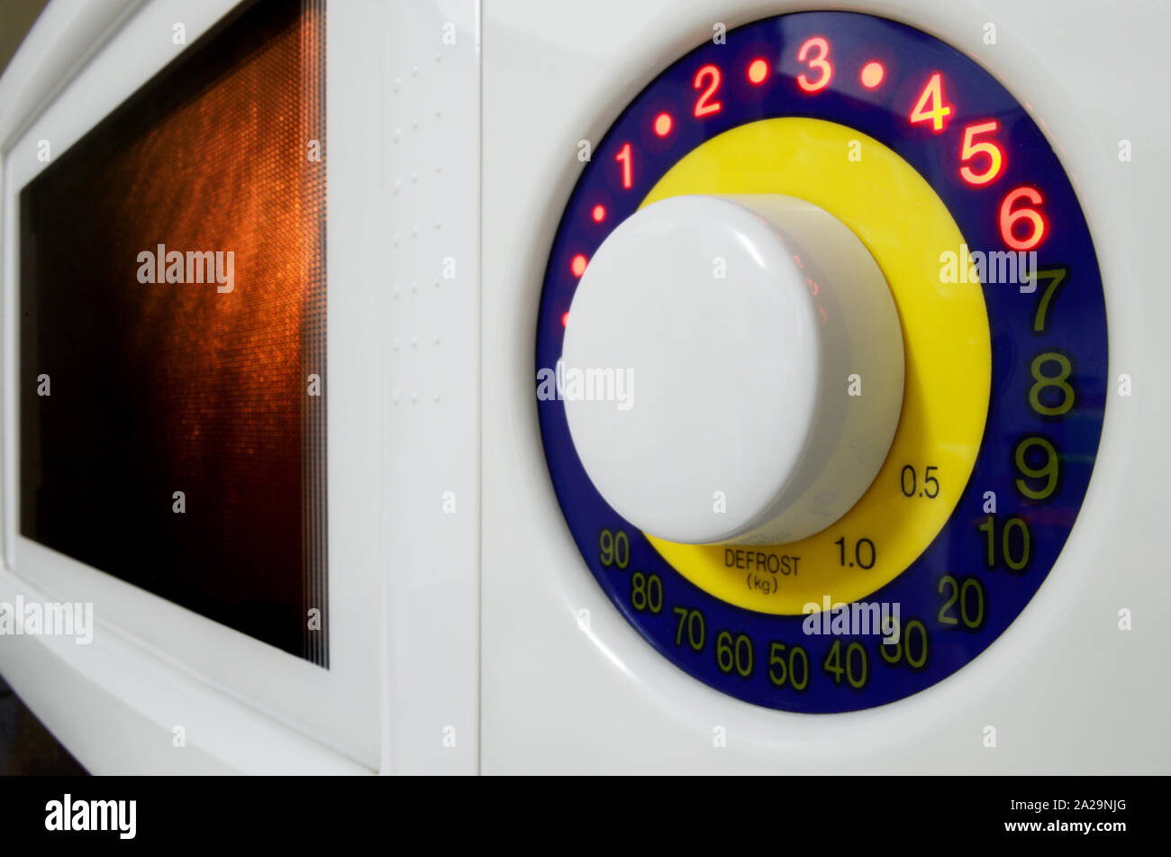 Microwave Oven Light-up Dial Timer Stock Photo - Alamy