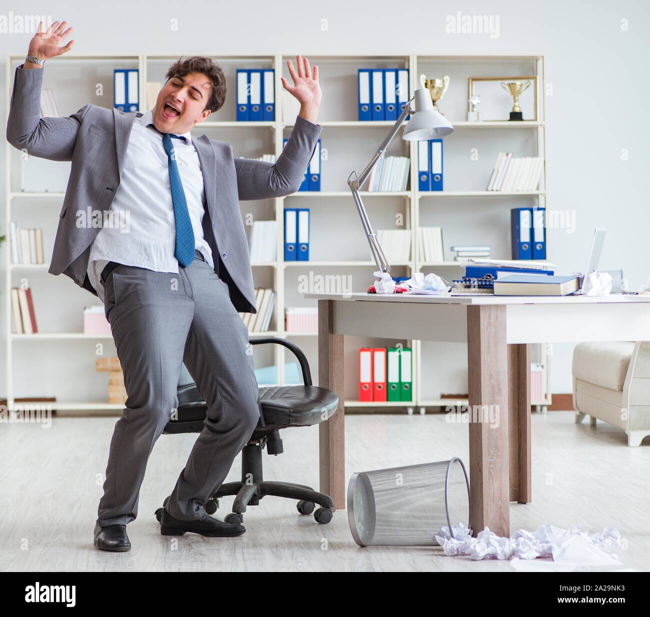 The businessman having fun taking a break in the office at work Stock ...