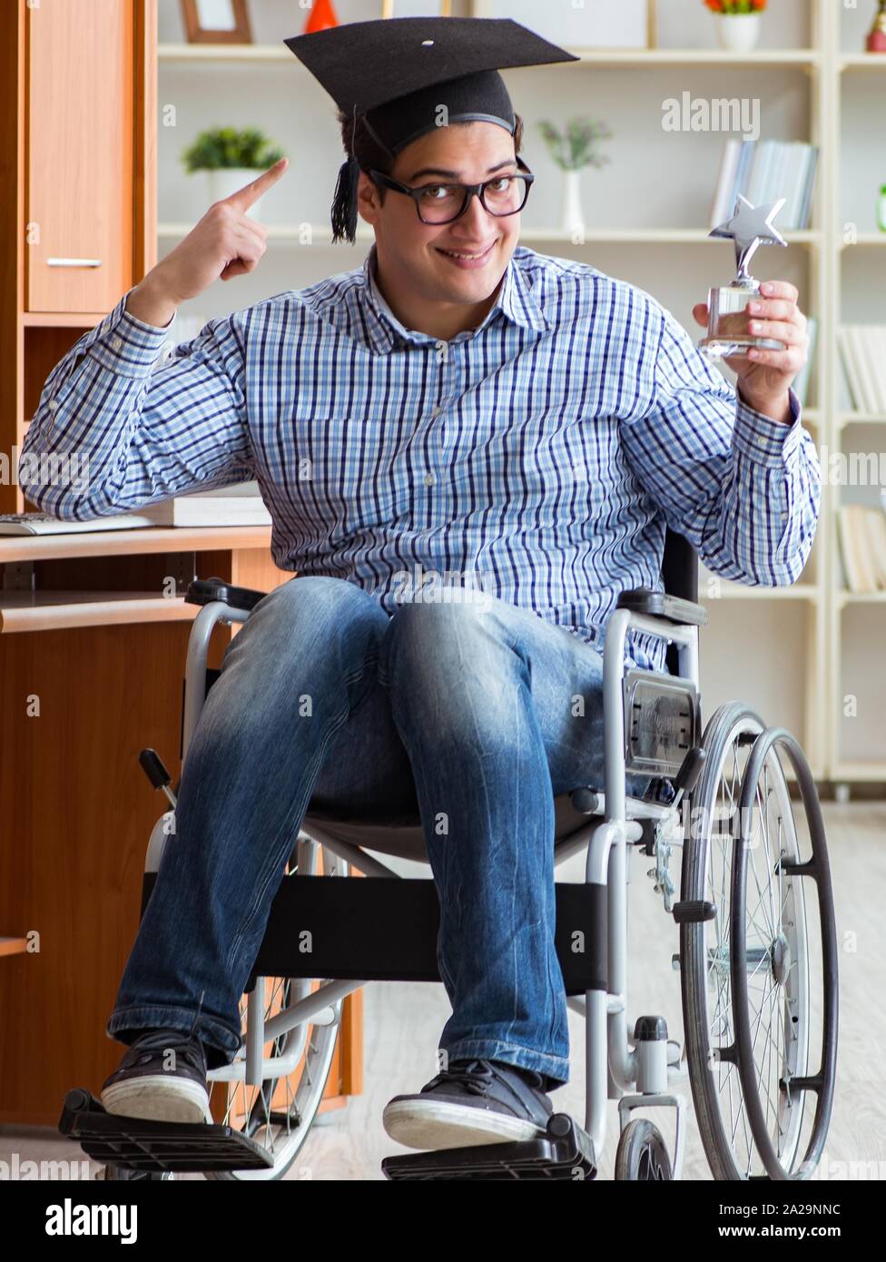 Disabled student studying at home on wheelchair Stock Photo - Alamy