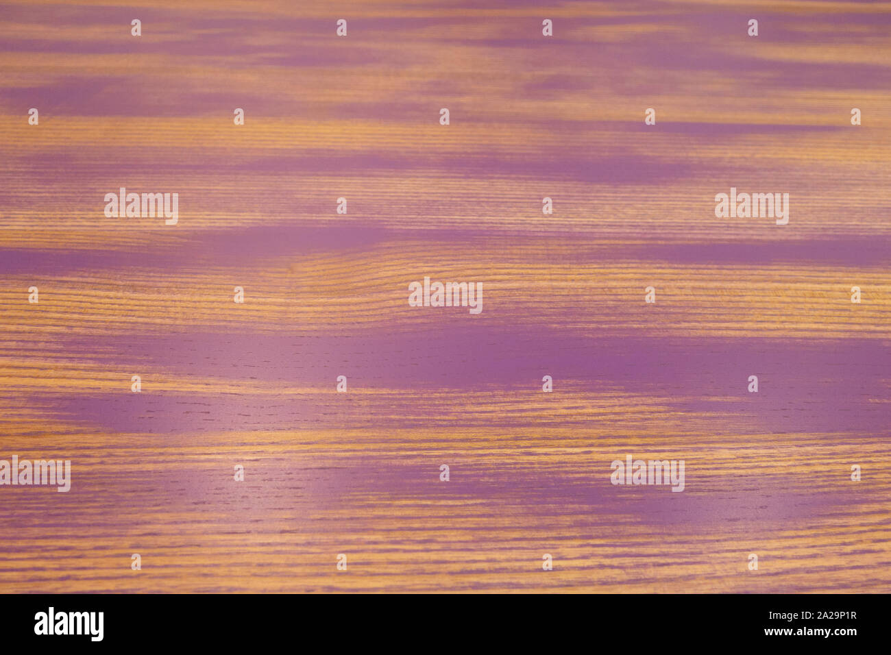 Wood panel painted in bright colors with aging effect. Wiped paint ...