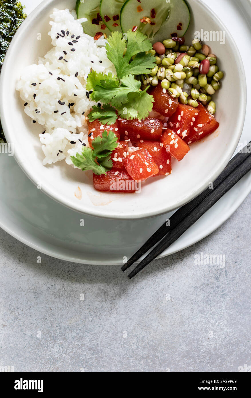 Sauteed watermelon poke bowl served with rice, cucumbers, and sprouted ...