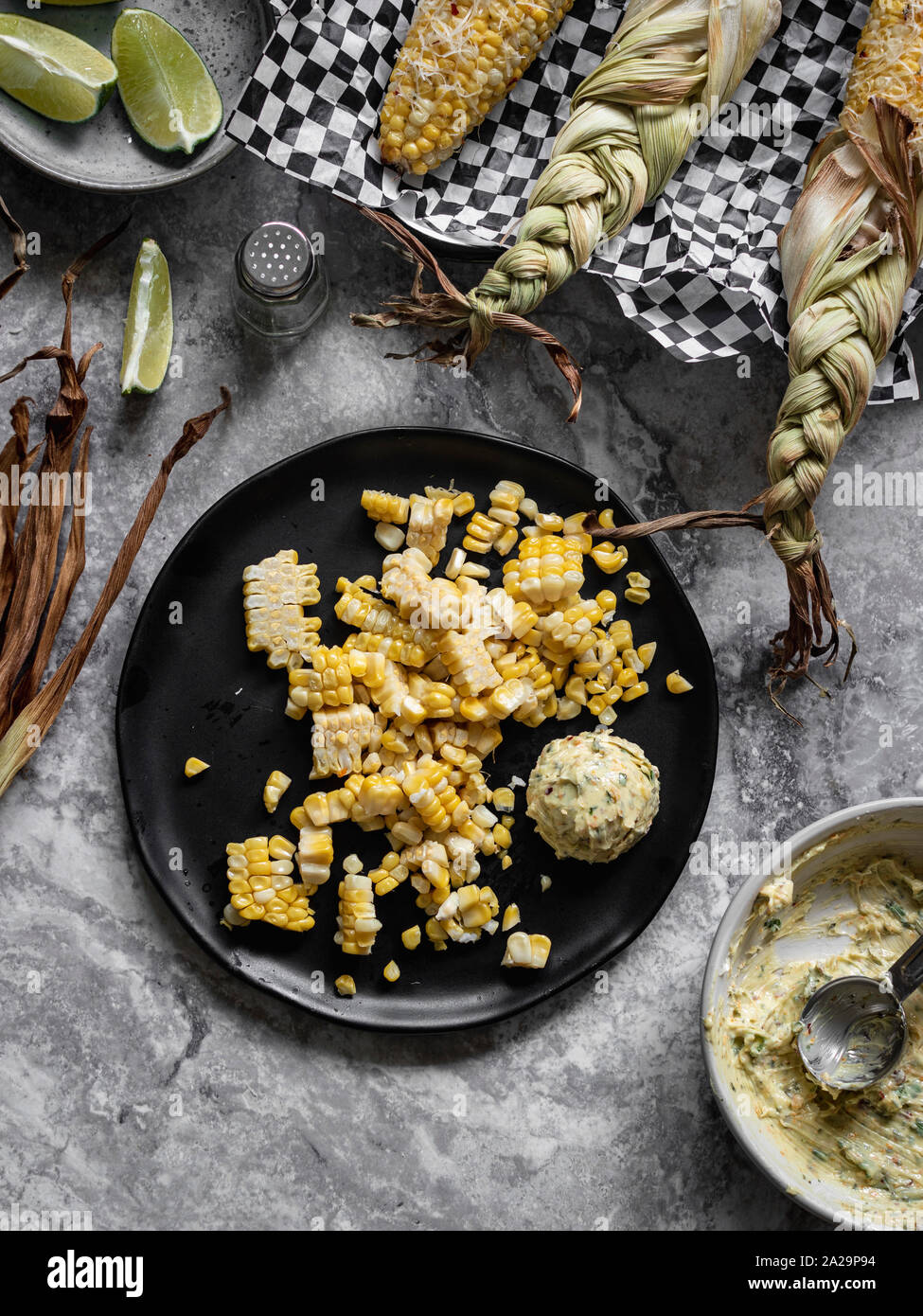 Shaved mexican street corn with herbed butter scoop on the plate Stock ...
