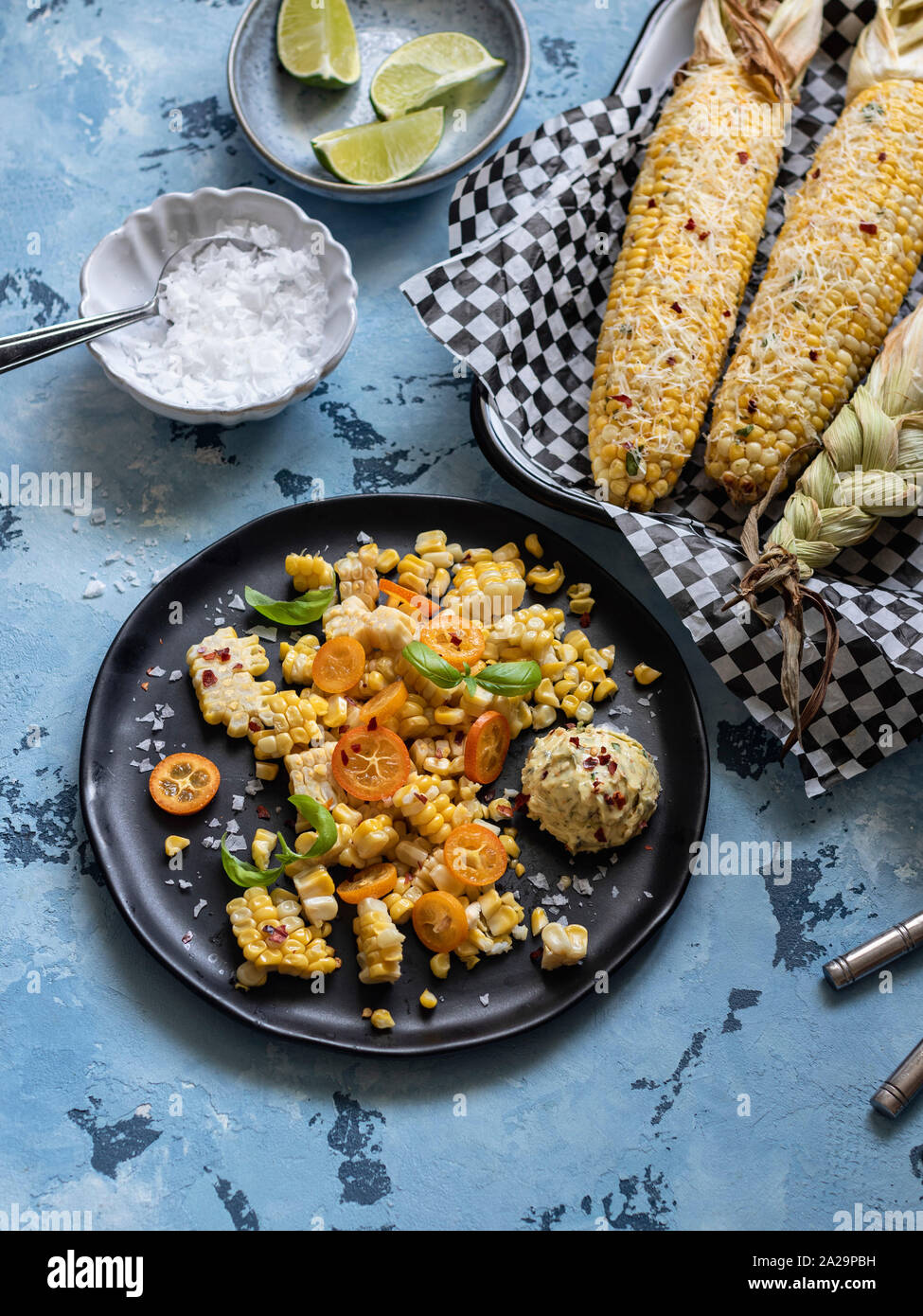 Shaved mexican street corn with herbed butter scoop on the plate Stock ...