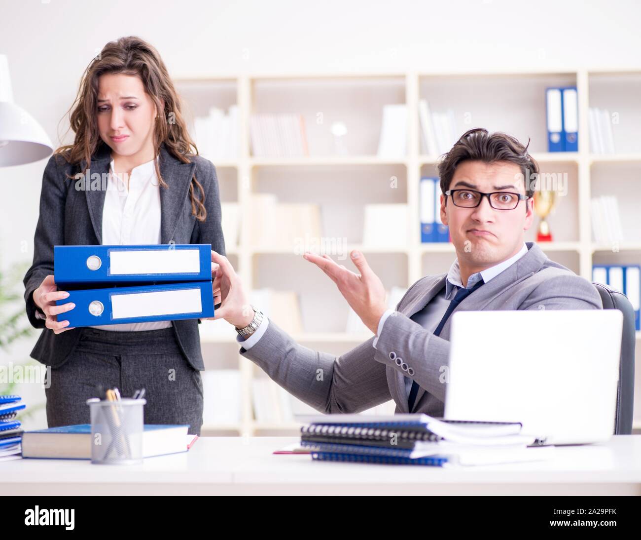 The angry boss unhappy with female employee performance Stock Photo - Alamy