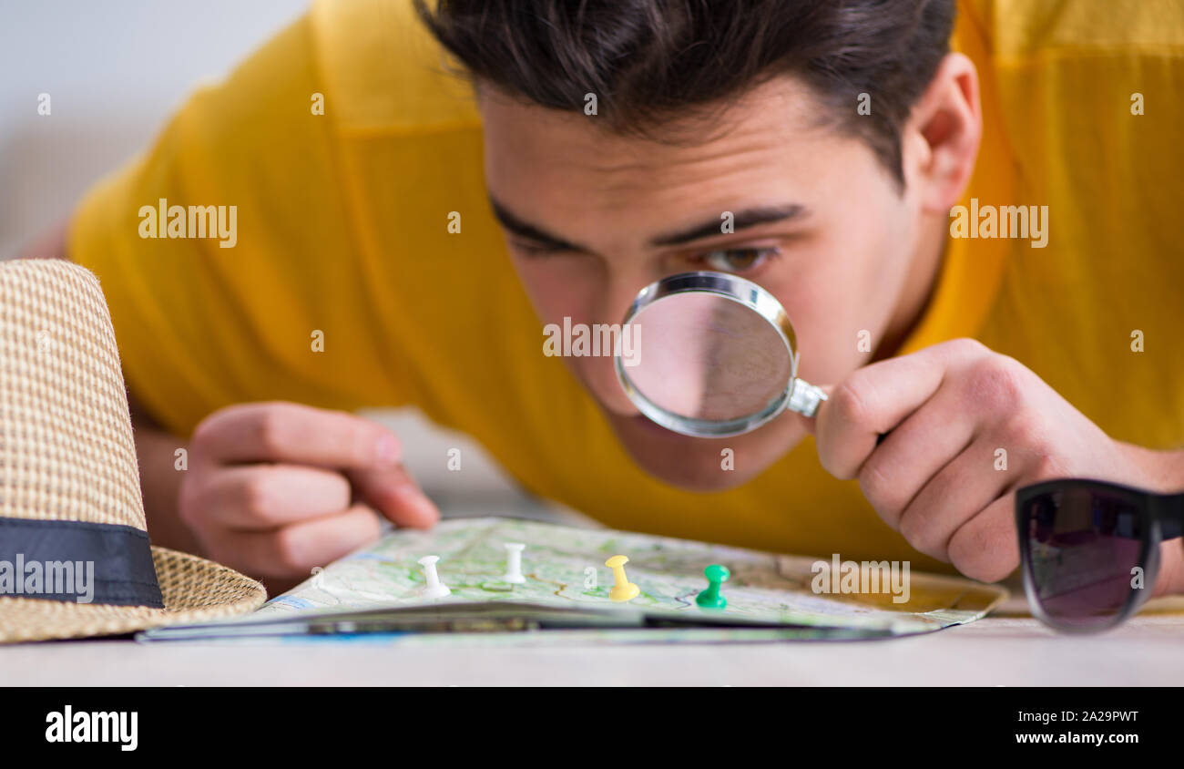 The man planning his vacation trip with map Stock Photo - Alamy