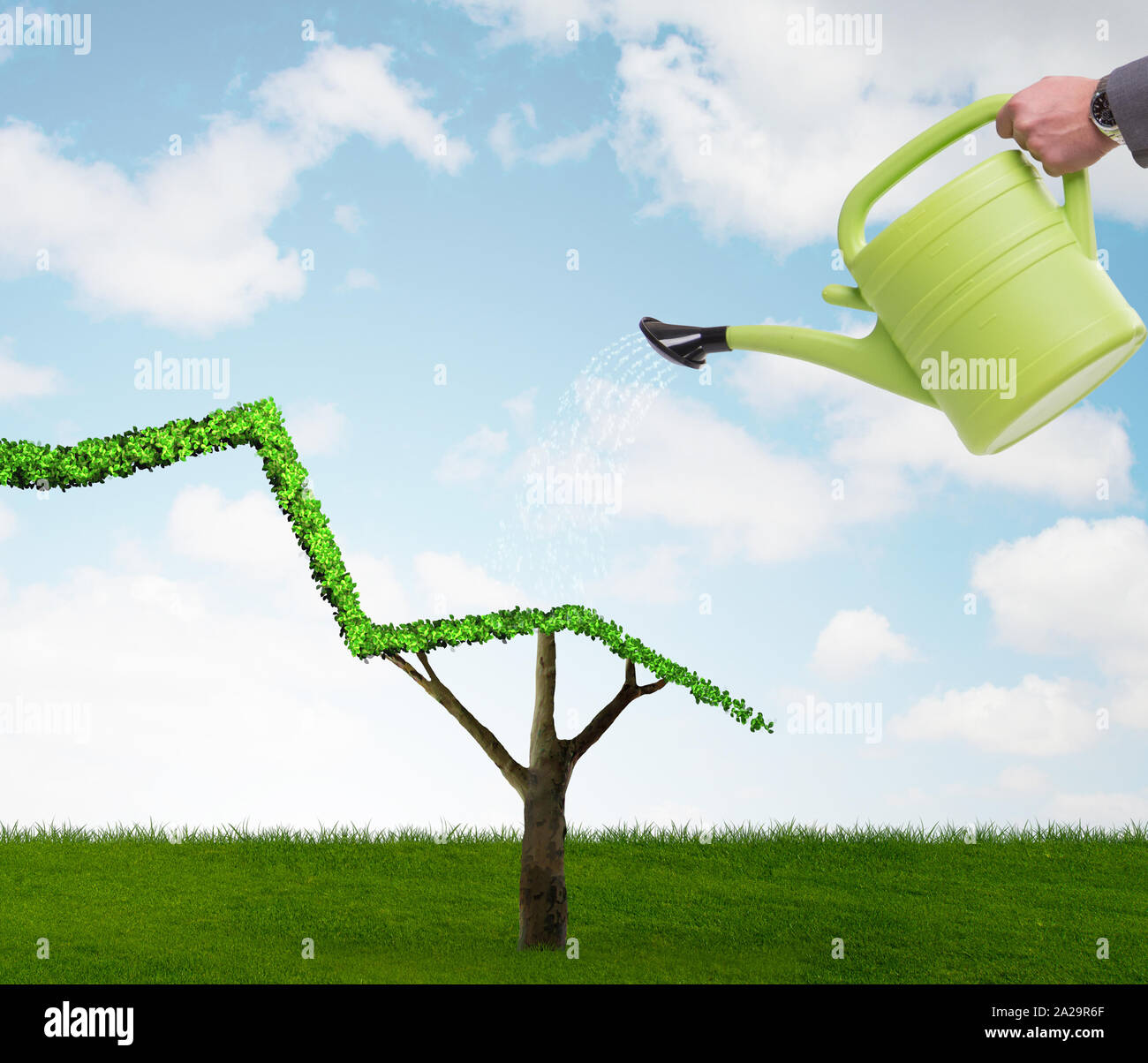 The businessman in investment concept watering financial line chart ...