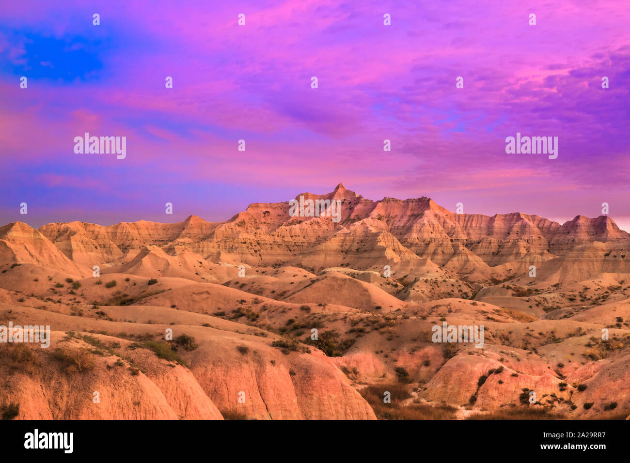 sunrise over the yellow mounds area of badlands national park near wall ...