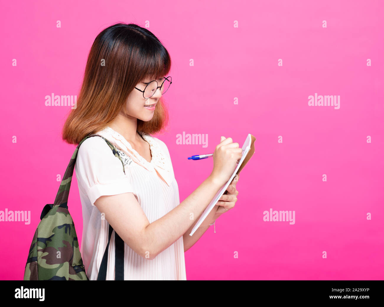 young girl student writing notebook Stock Photo - Alamy