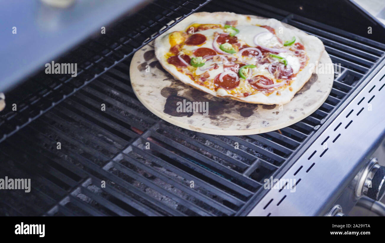 Cooking pizza on outdoor gas hi-res stock photography and images - Alamy
