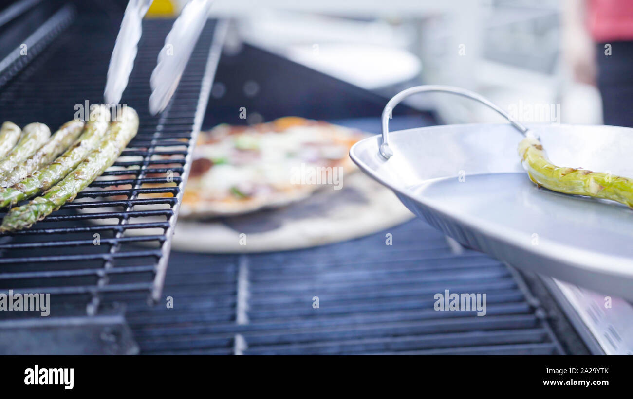 Cooking pizza on outdoor gas grill Stock Photo - Alamy