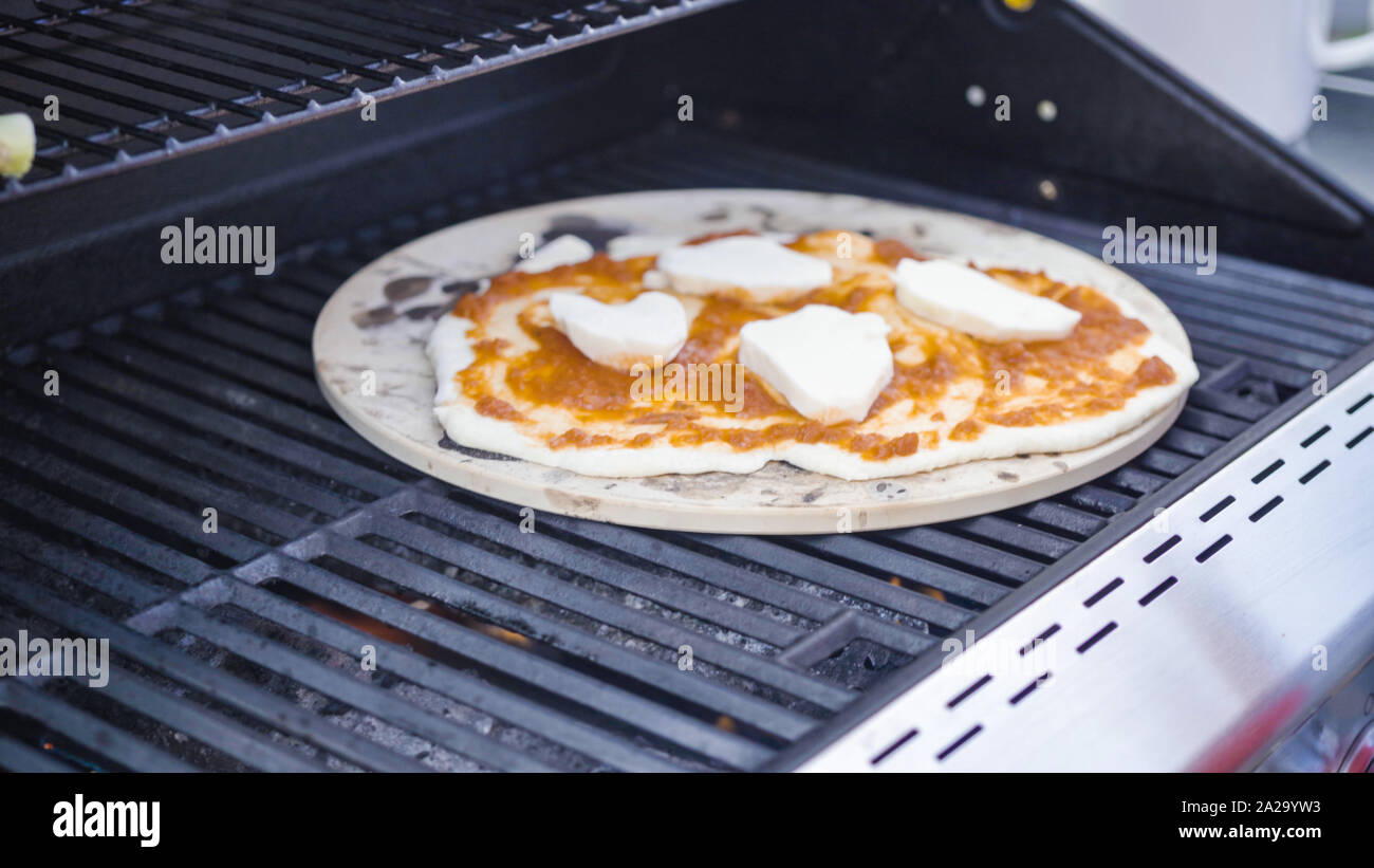 Cooking pizza on outdoor gas hi-res stock photography and images - Alamy