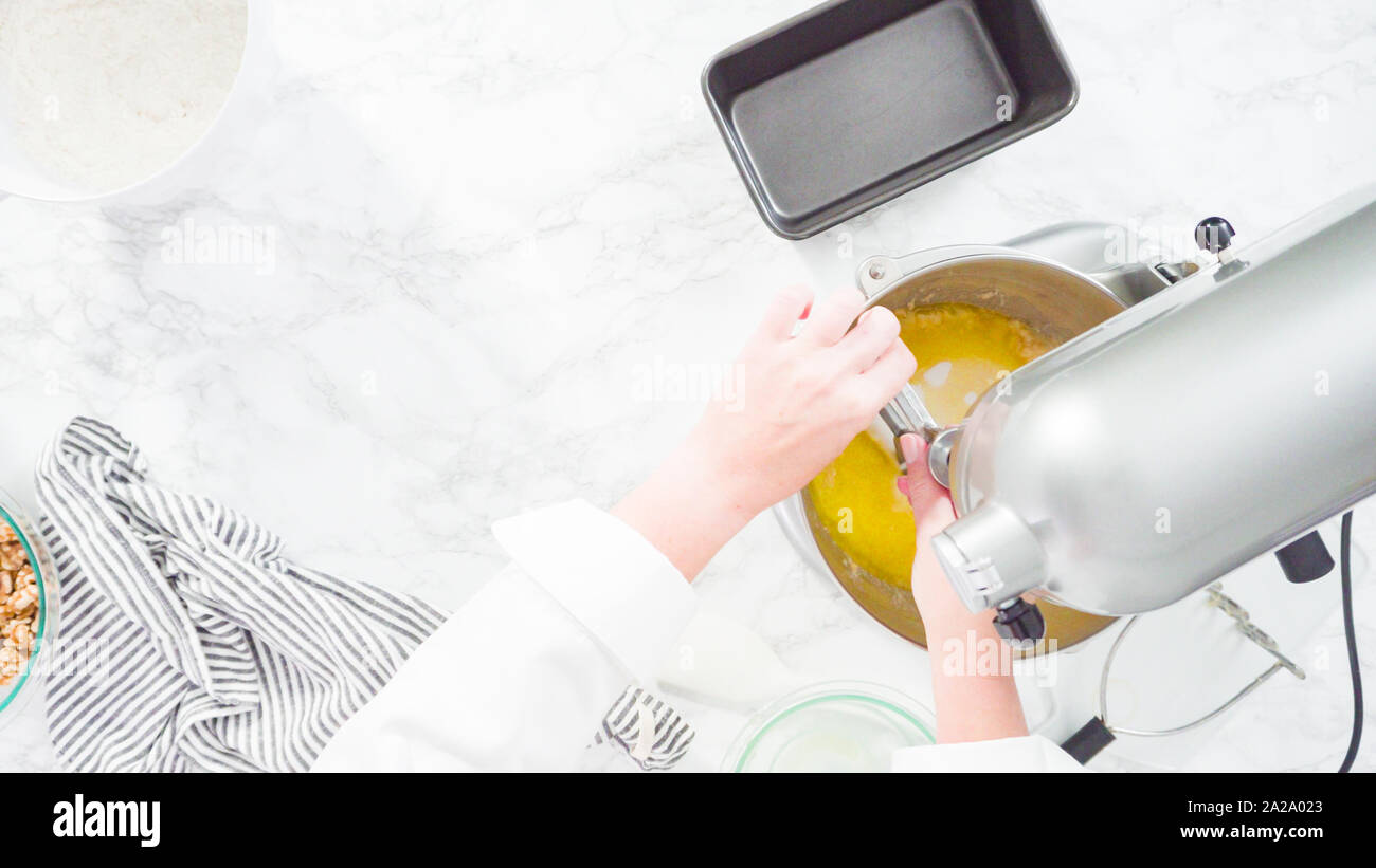Flat lay. Step by step. Mixing ingredients together into a metal mixing ...