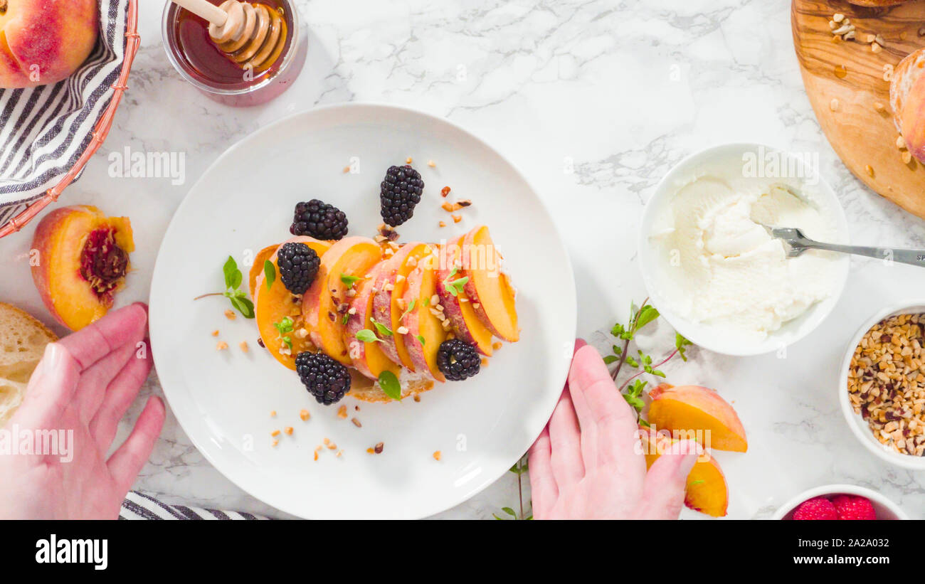 Flat lay. Step by step. Making ricotta toasts with organic peaches and ...