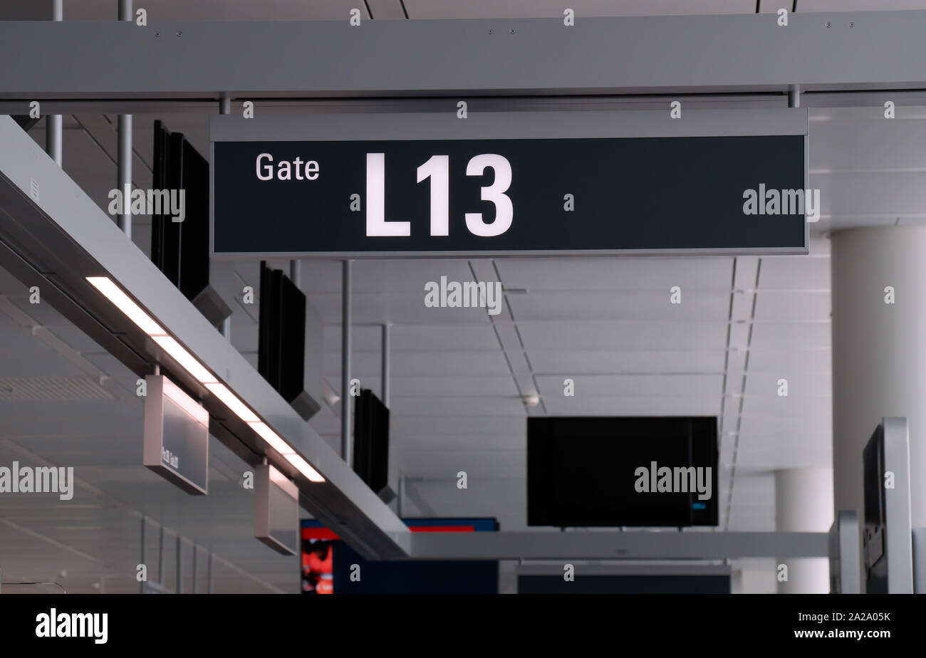 Gate number sign hanging from the ceiling in the airport hall Stock ...